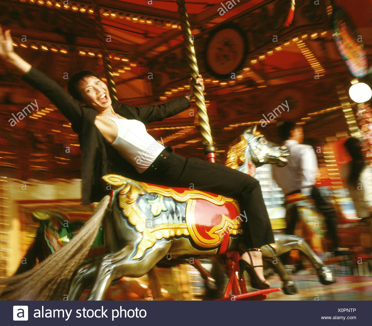 Woman Sitting Horse On Carousel Stock Photos & Woman Sitting Horse On ...