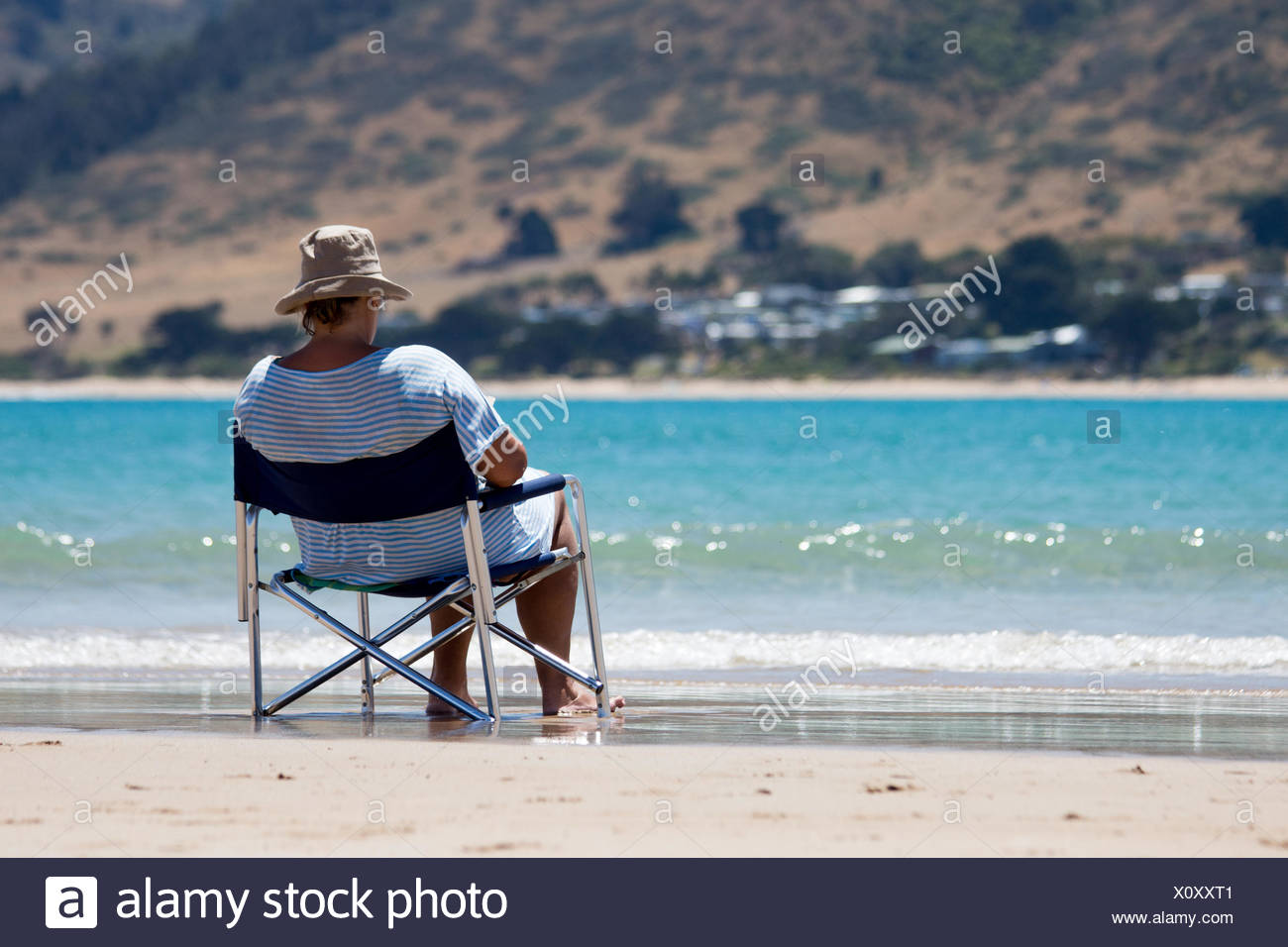 Woman Sitting In Beach Chair Stock Photos & Woman Sitting In Beach ...