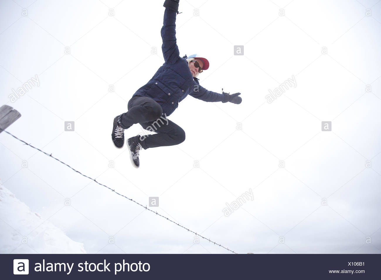Man Jumping Over Fence High Resolution Stock Photography and Images - Alamy