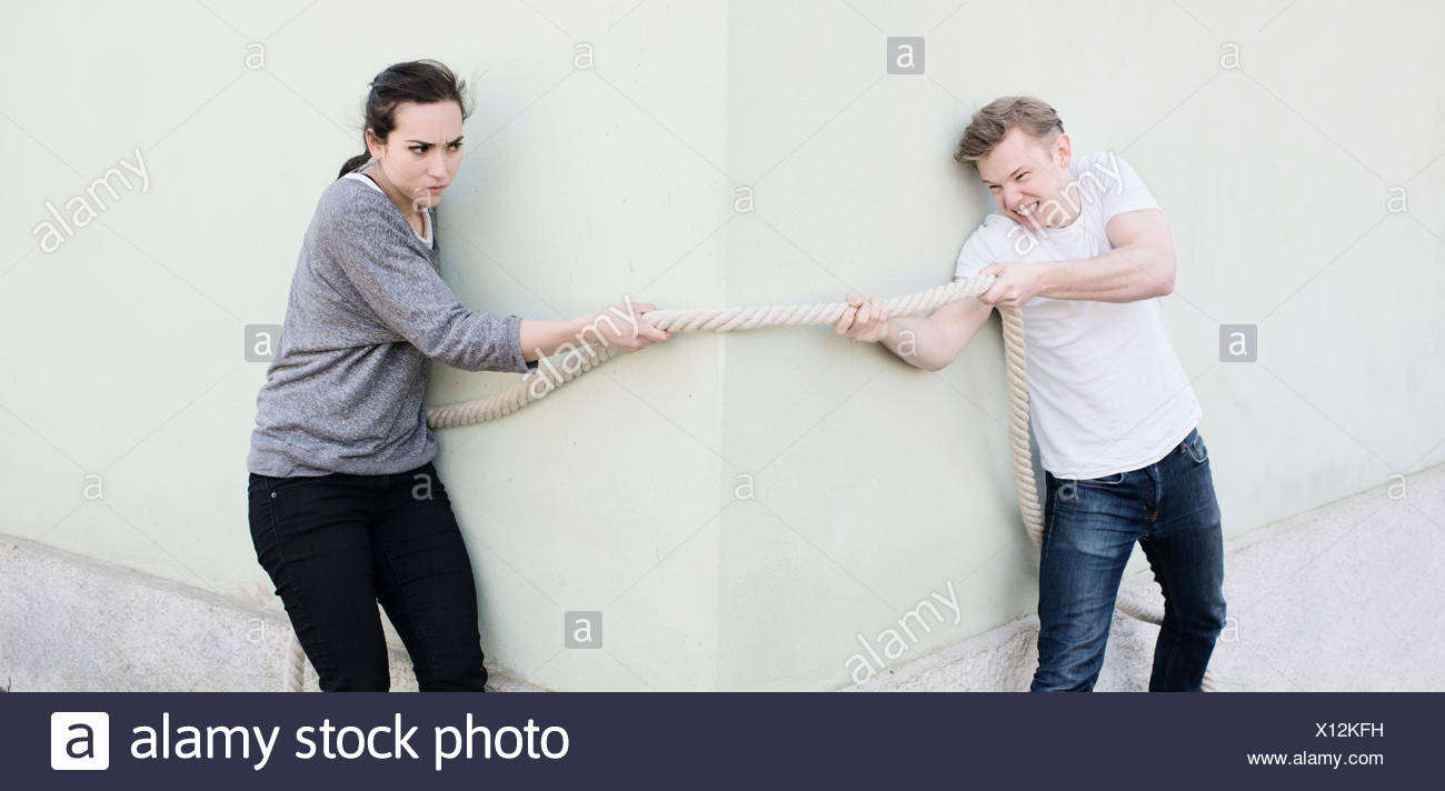 Couple Pulling Rope High Resolution Stock Photography and Images - Alamy