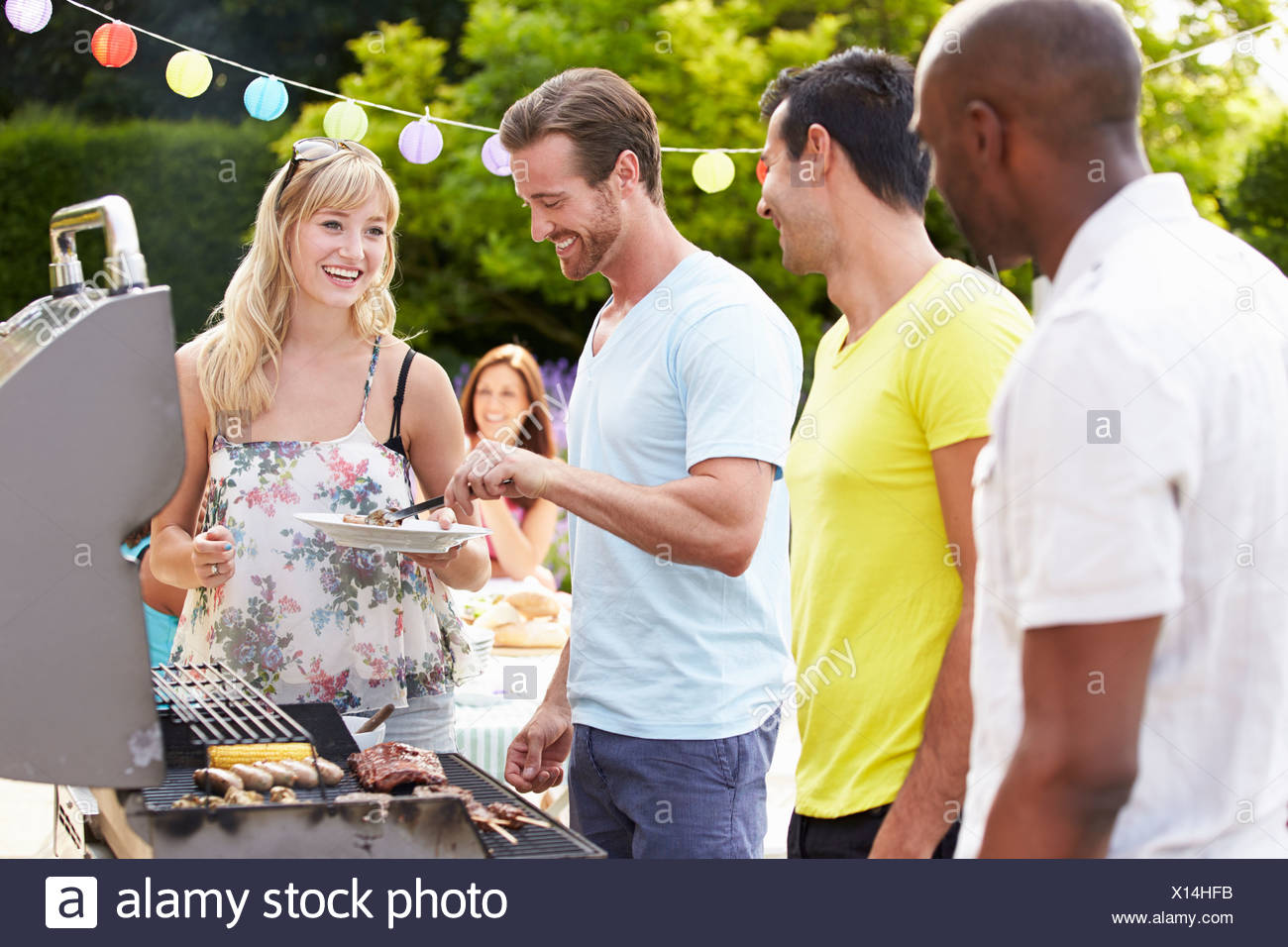 Friends Relaxing Garden High Resolution Stock Photography and Images ...