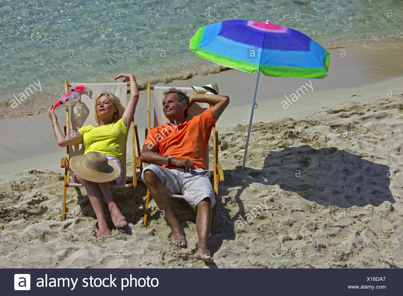 Old Woman Sunbathing On Beach Stock Photos & Old Woman Sunbathing On ...