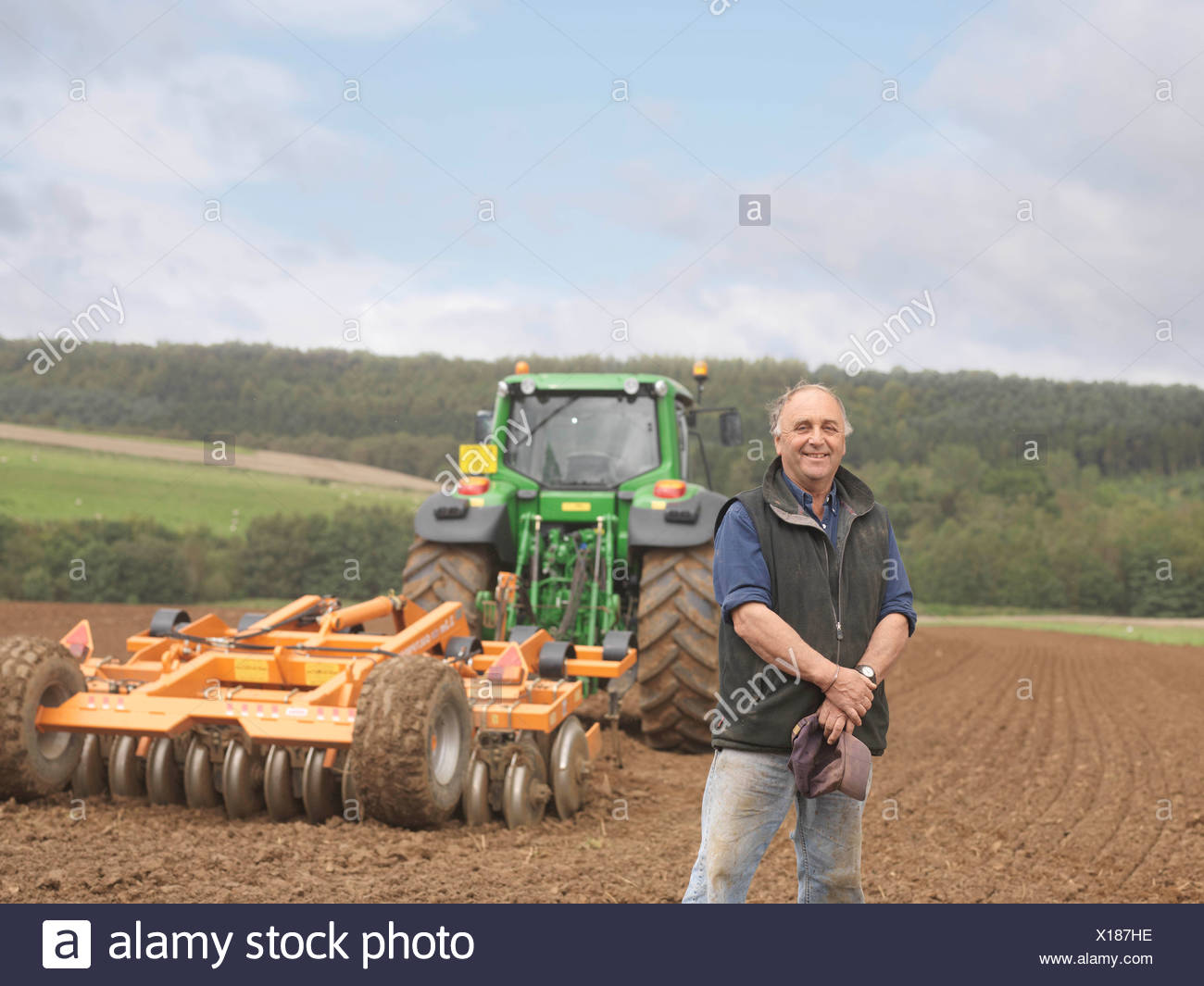 Farmer Posing With Tractor High Resolution Stock Photography and Images ...