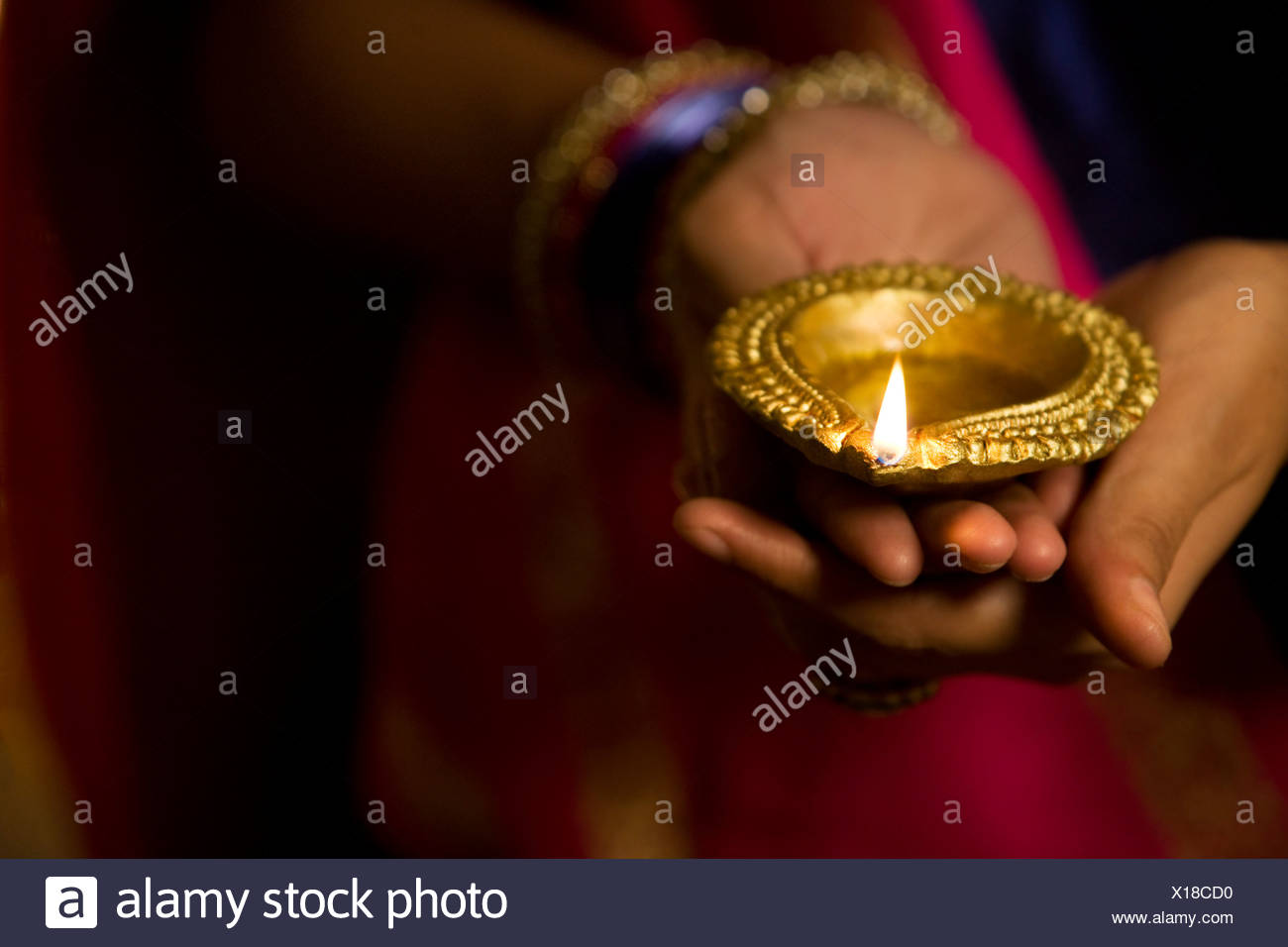 Woman Holding Diya High Resolution Stock Photography and Images - Alamy