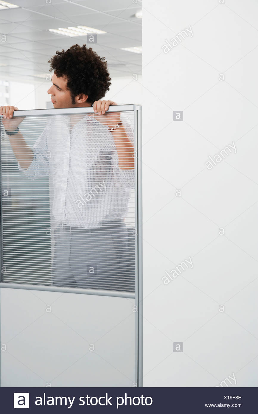 Man Peeking Over Cubicle Wall High Resolution Stock Photography and ...