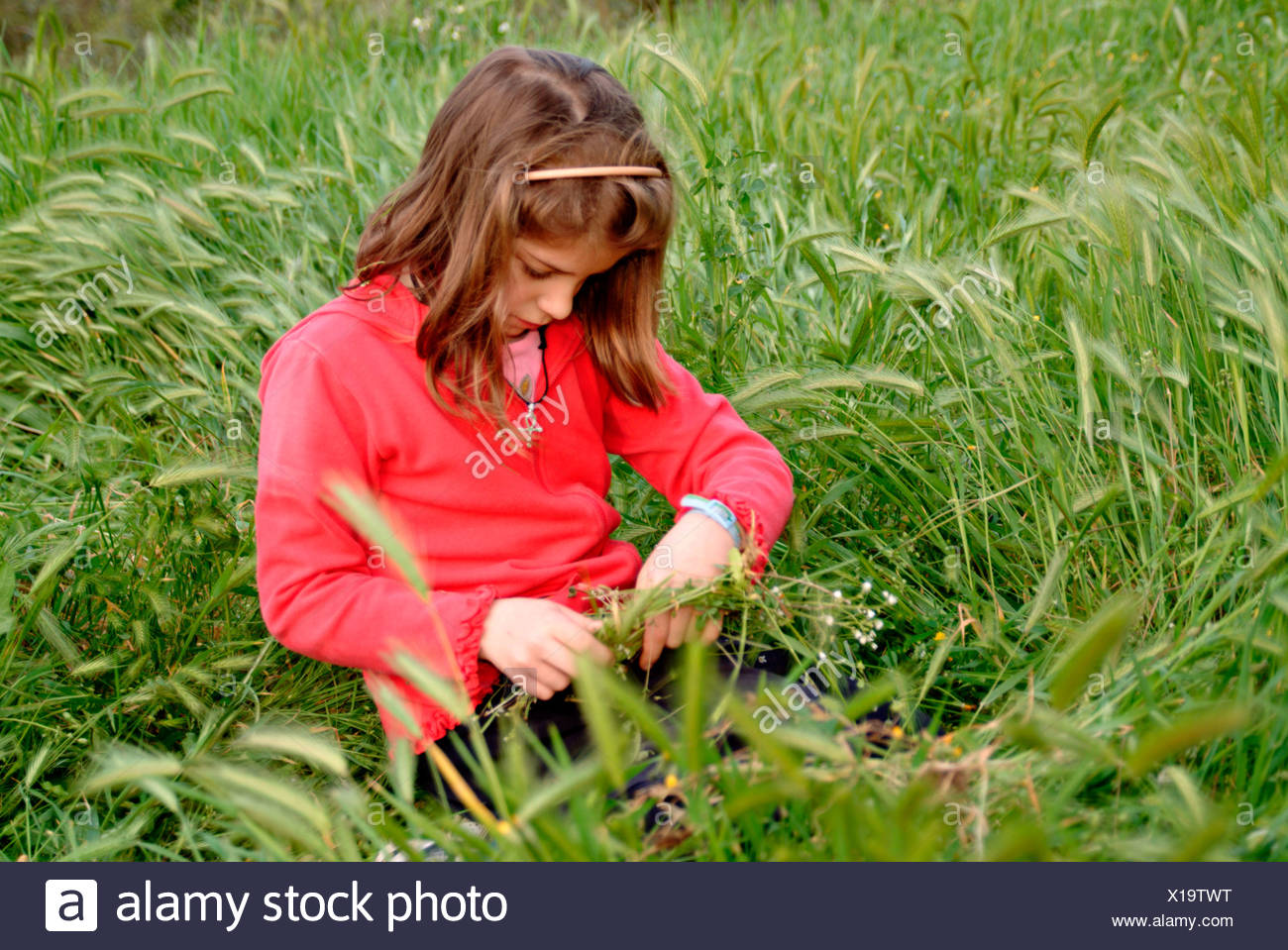 Girl Making Flower Garland High Resolution Stock Photography and Images ...