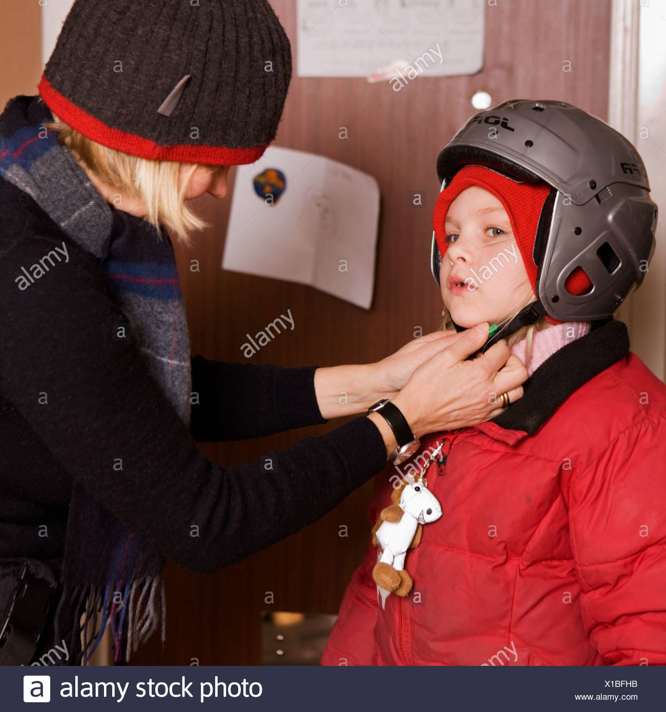 Woman Putting On A Helmet High Resolution Stock Photography and Images ...