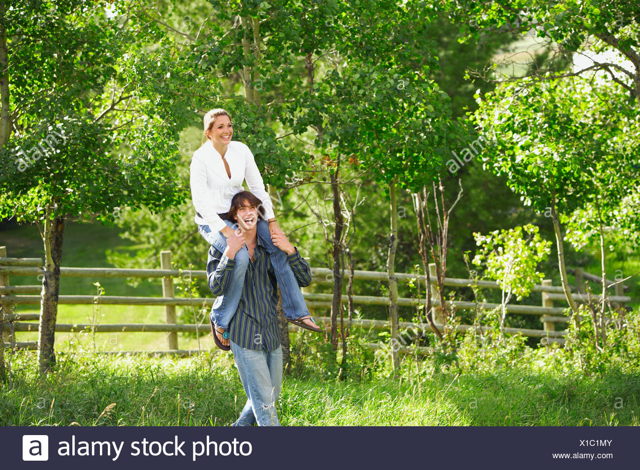 Carrying A Friend On Shoulders High Resolution Stock Photography and ...