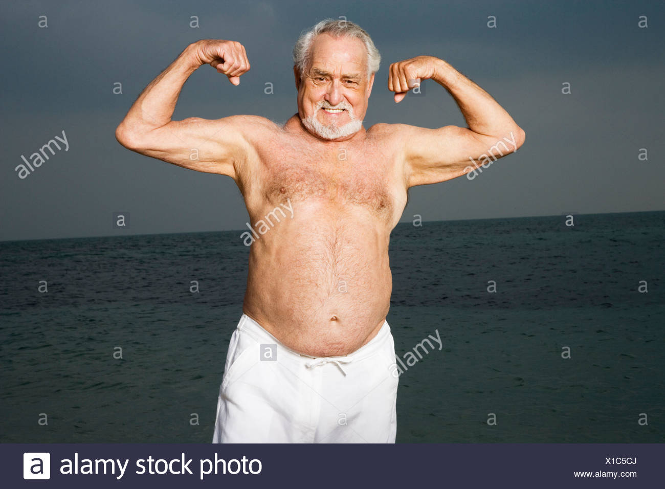 Senior Flexing Muscles Stock Photos & Senior Flexing Muscles Stock ...