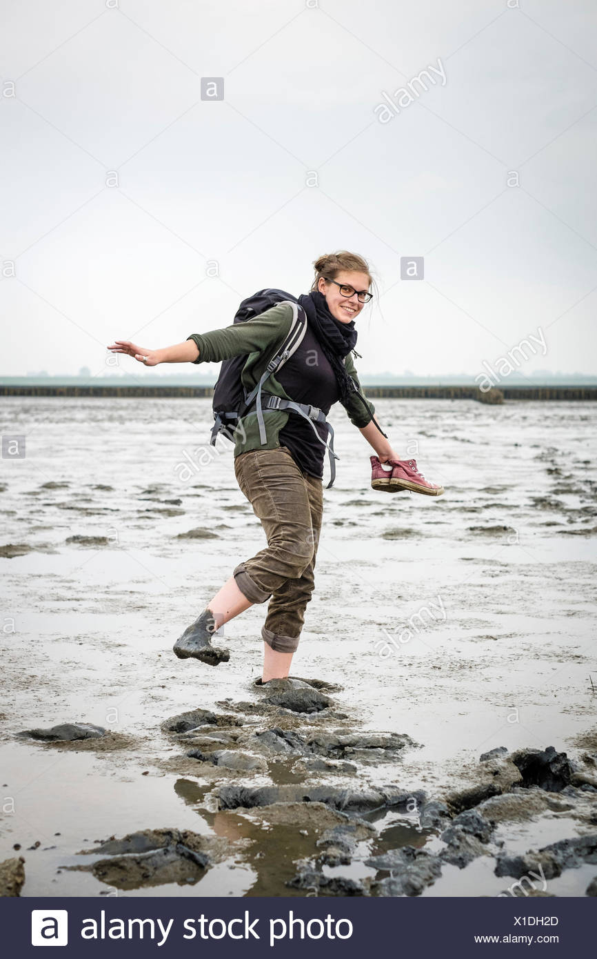 Woman Walking Barefoot In Mud High Resolution Stock Photography and ...