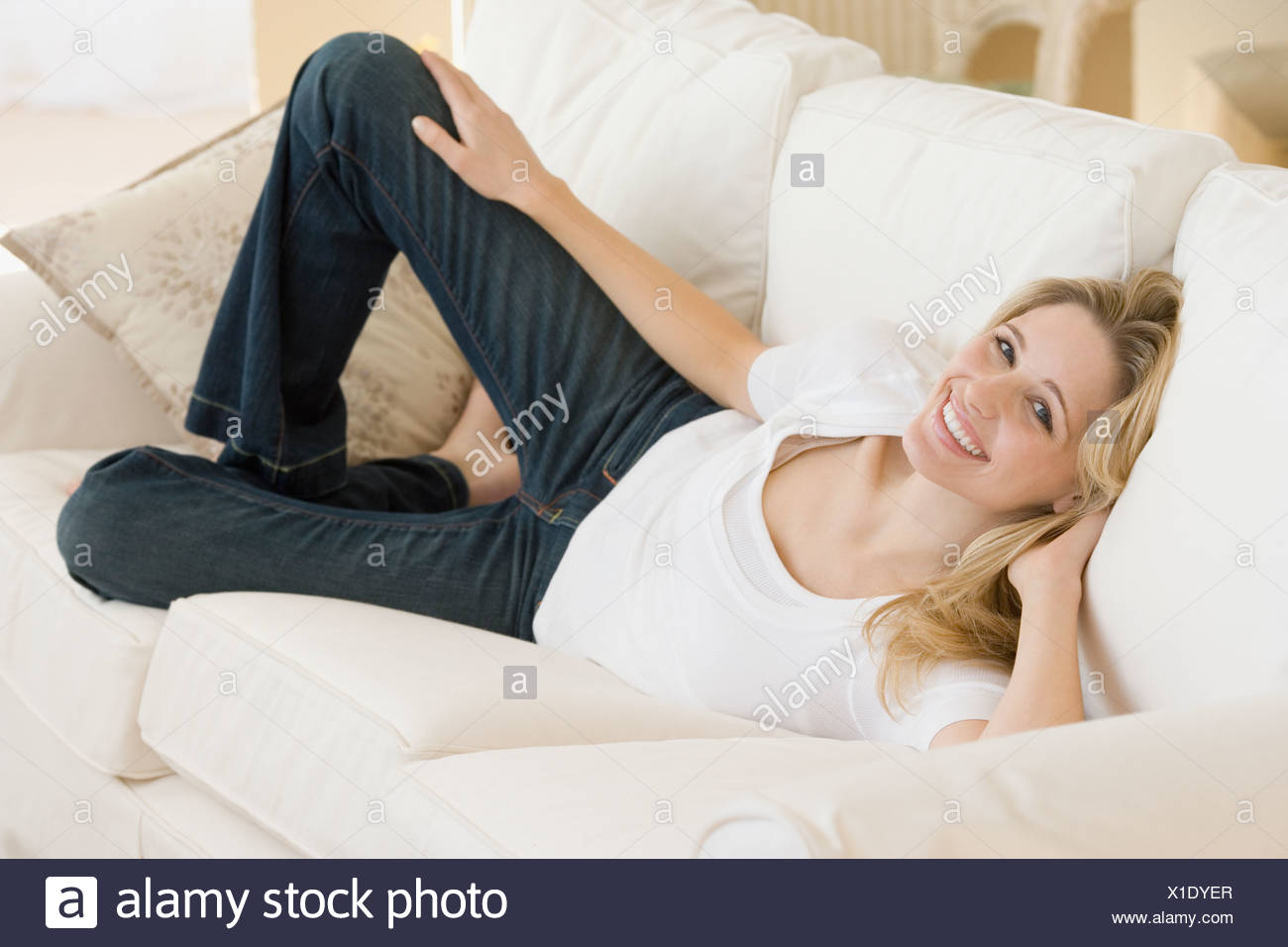 Woman Reclining On Couch High Resolution Stock Photography and Images ...