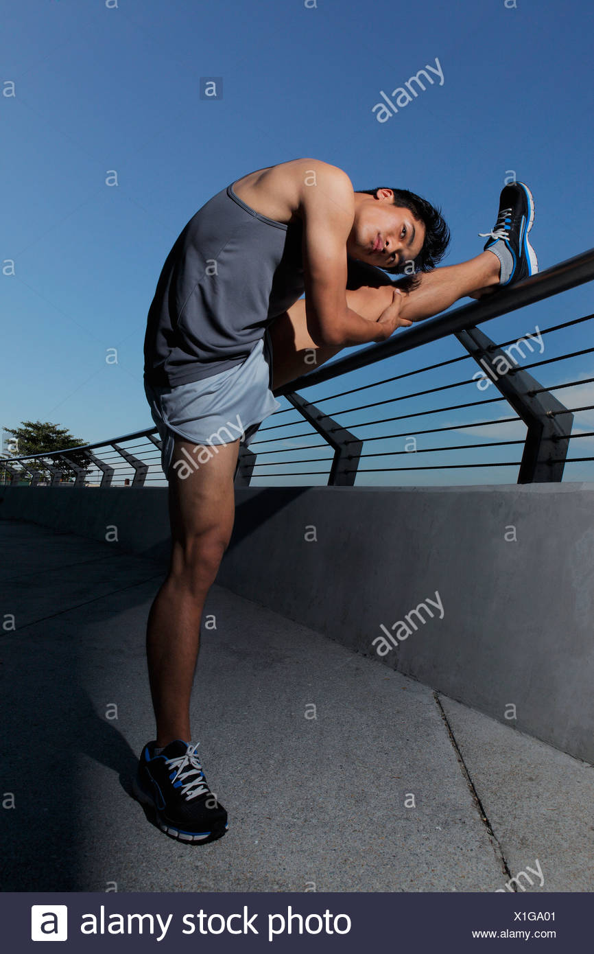 Young Man Standing One Leg High Resolution Stock Photography and Images ...