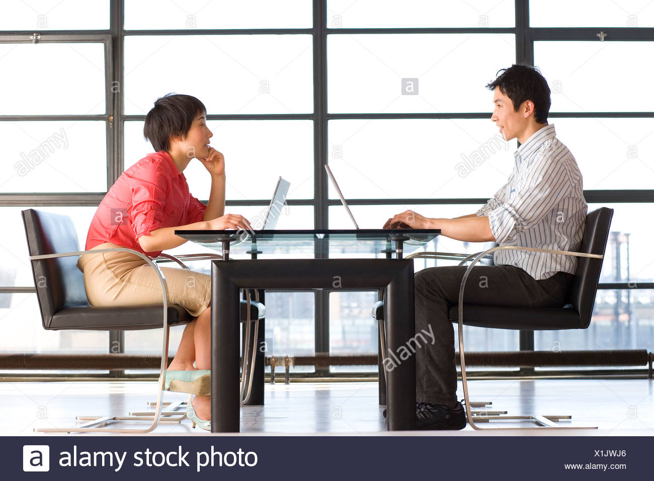 Two Women Sitting Opposite Each Other Stock Photos & Two Women Sitting ...