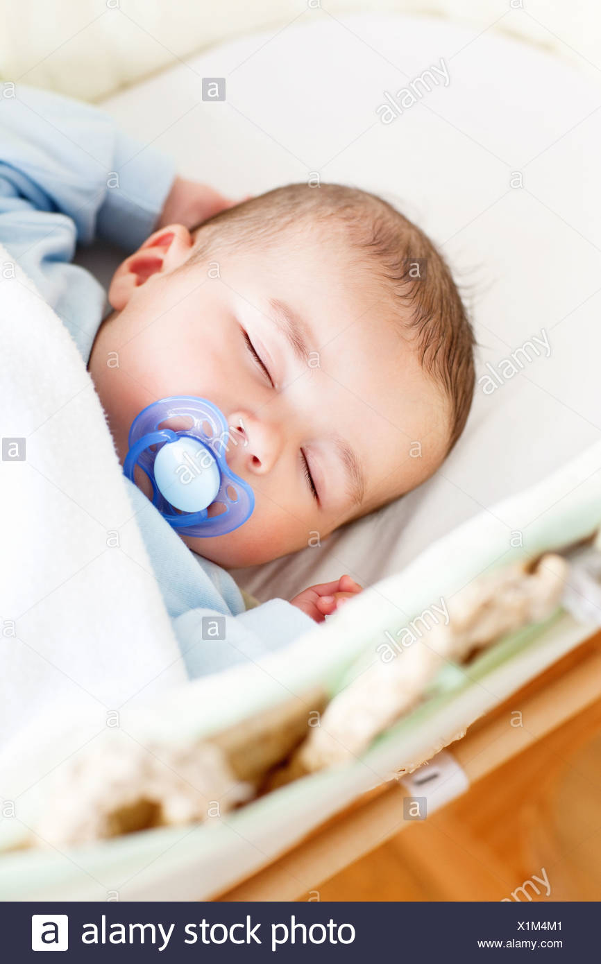 Baby In Cradle High Resolution Stock Photography and Images - Alamy