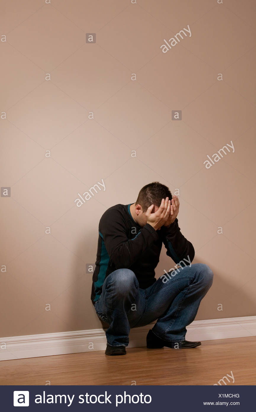 Man Crouching Scared High Resolution Stock Photography and Images - Alamy
