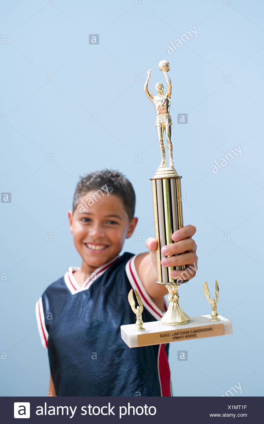 Boy Holding Trophy High Resolution Stock Photography and Images - Alamy