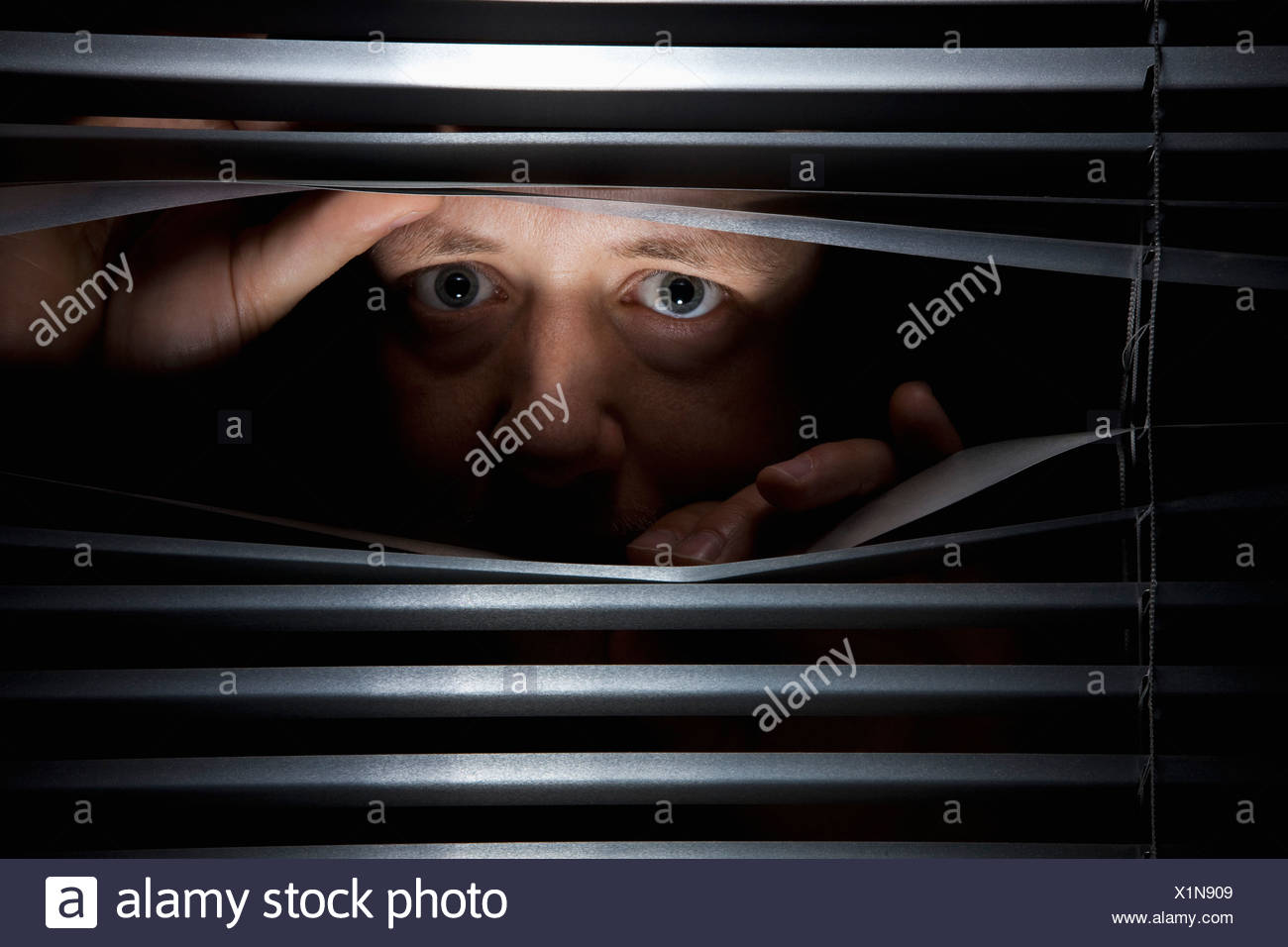 Peeking Through Blinds High Resolution Stock Photography and Images - Alamy