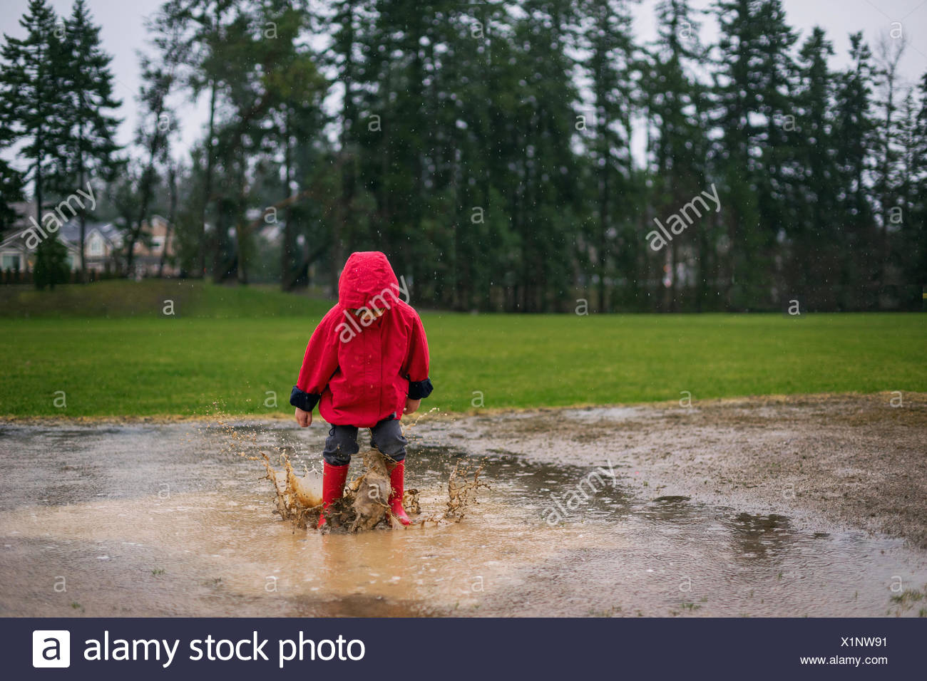 Boy In Puddle High Resolution Stock Photography and Images - Alamy