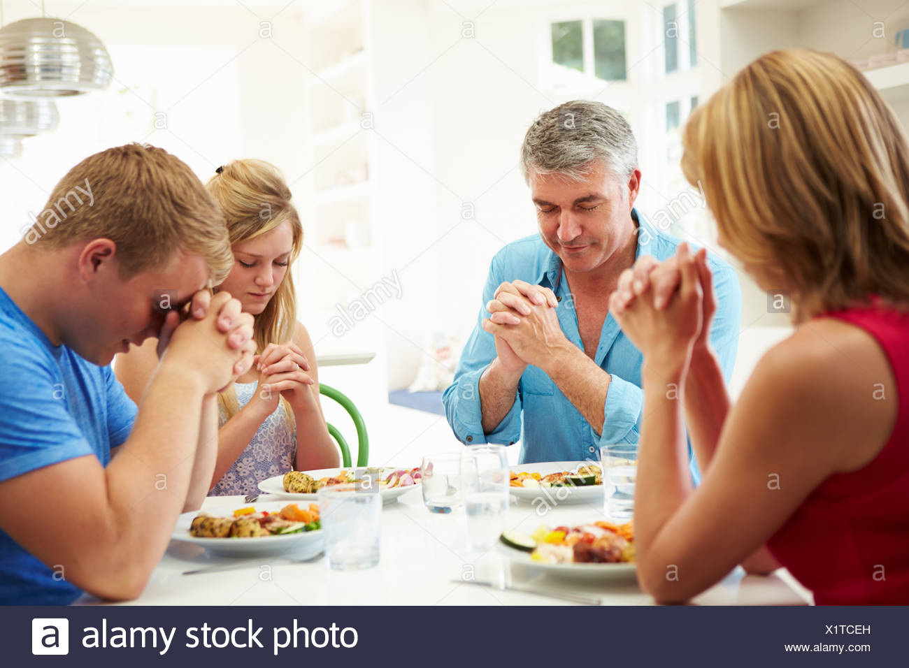 Praying Family High Resolution Stock Photography and Images - Alamy