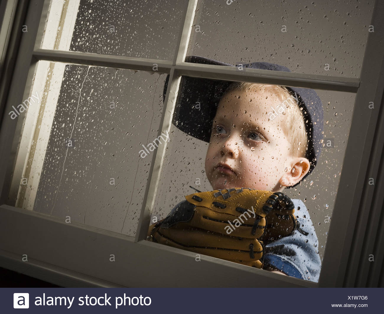 Boy Looking Out Window Rain High Resolution Stock Photography and ...