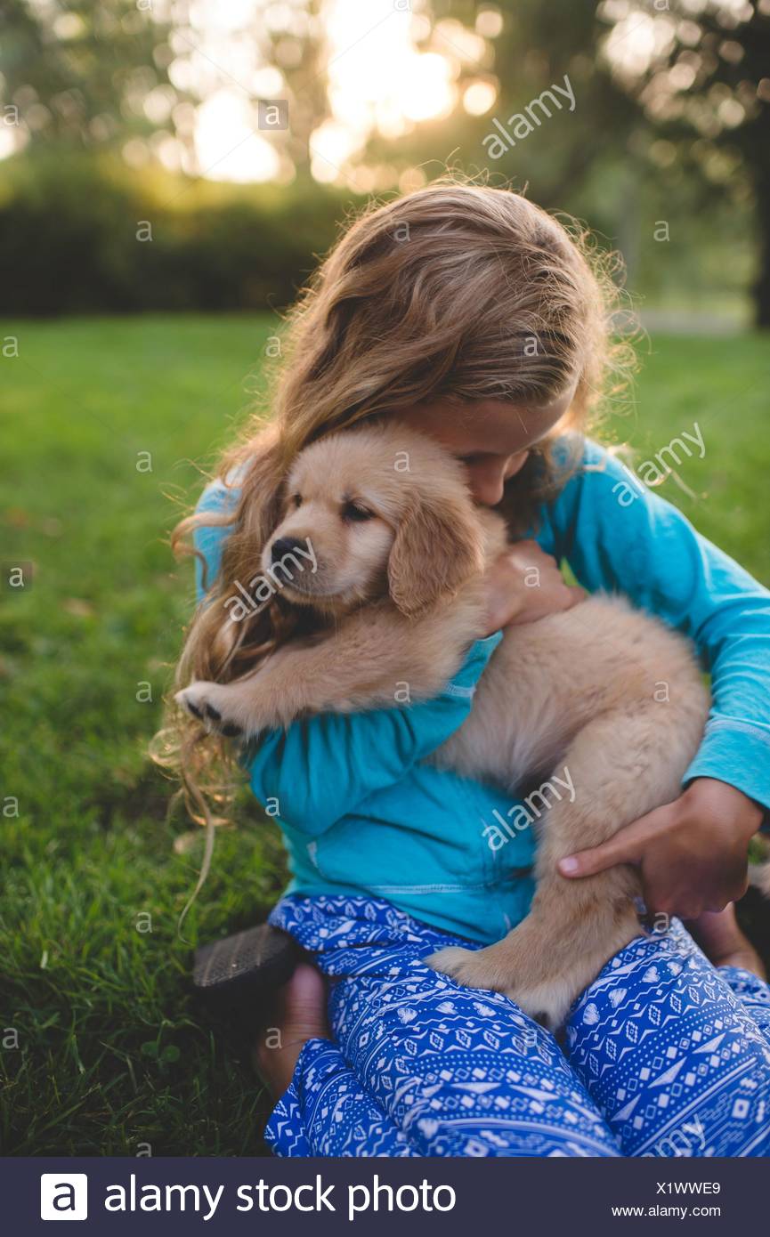 Child Puppy Hugging Stock Photos & Child Puppy Hugging Stock Images - Alamy