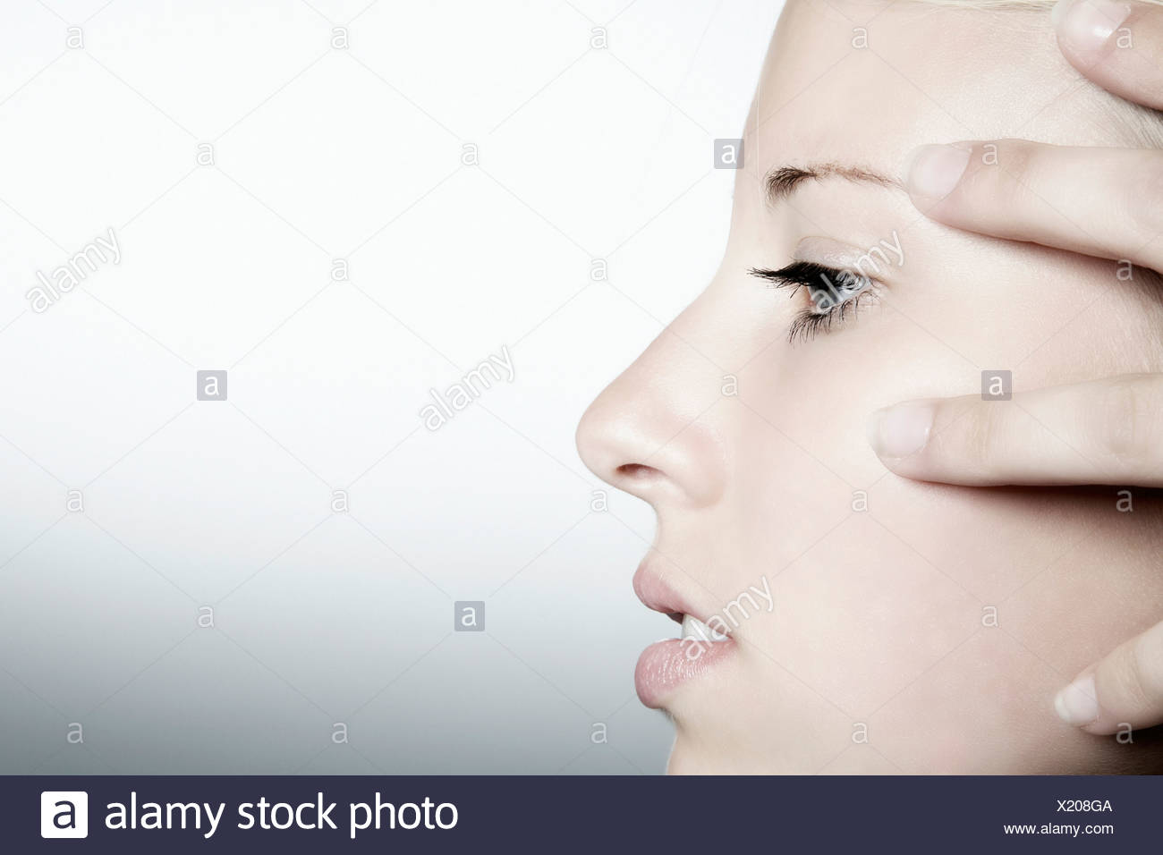 Hand On Her Cheek High Resolution Stock Photography and Images - Alamy