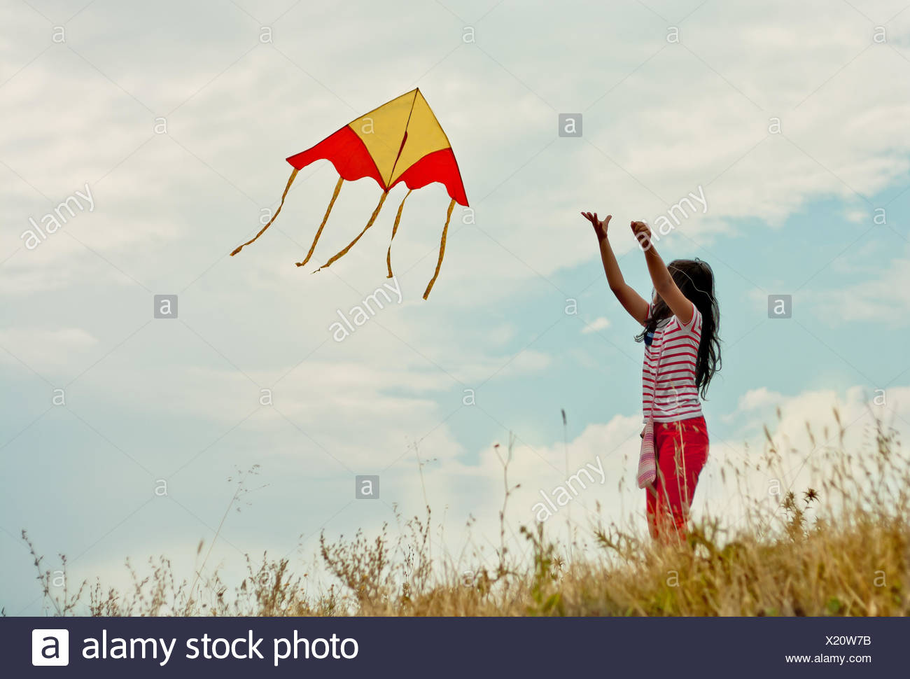 Girl Holding Kite High Resolution Stock Photography and Images - Alamy