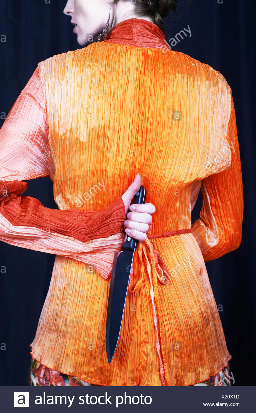 Woman Holding Knife Behind Back High Resolution Stock Photography and ...