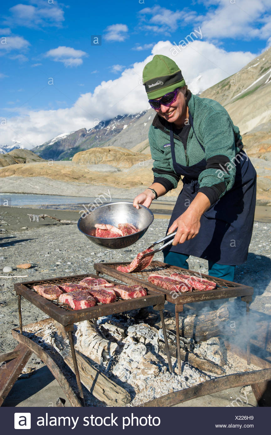 Woman Cooking Over Open Fire Stock Photos & Woman Cooking Over Open ...