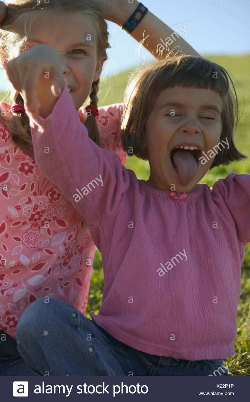Girls Making Funny Faces Tongue High Resolution Stock Photography and ...