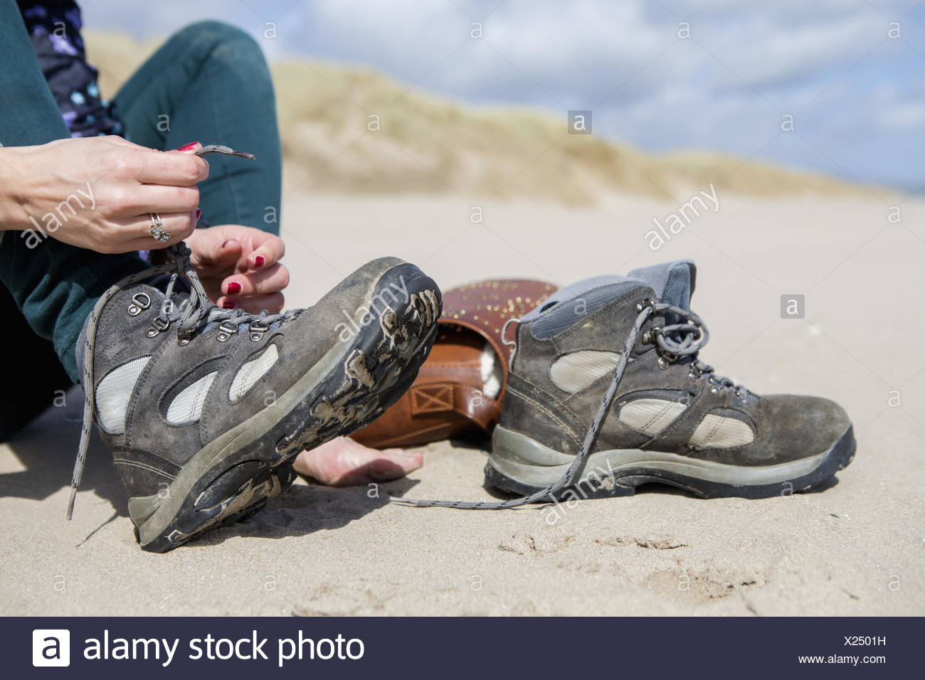 Woman Taking Off Her Boots High Resolution Stock Photography and Images ...