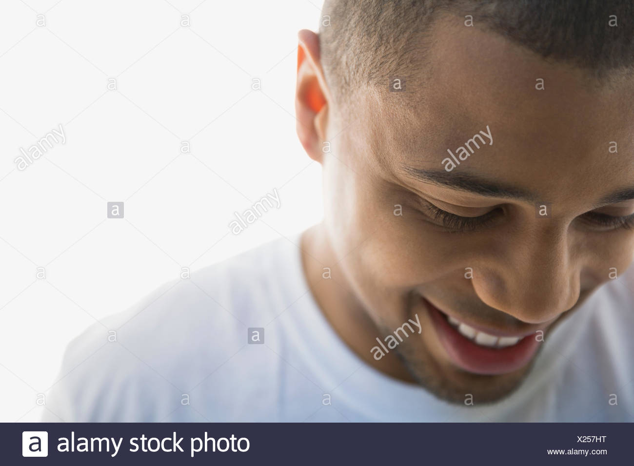 Man Smiling Looking Down Stock Photos & Man Smiling Looking Down Stock ...