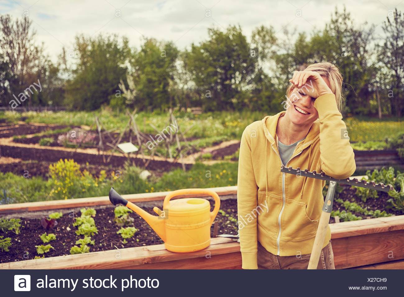 Woman With Rake High Resolution Stock Photography and Images - Alamy