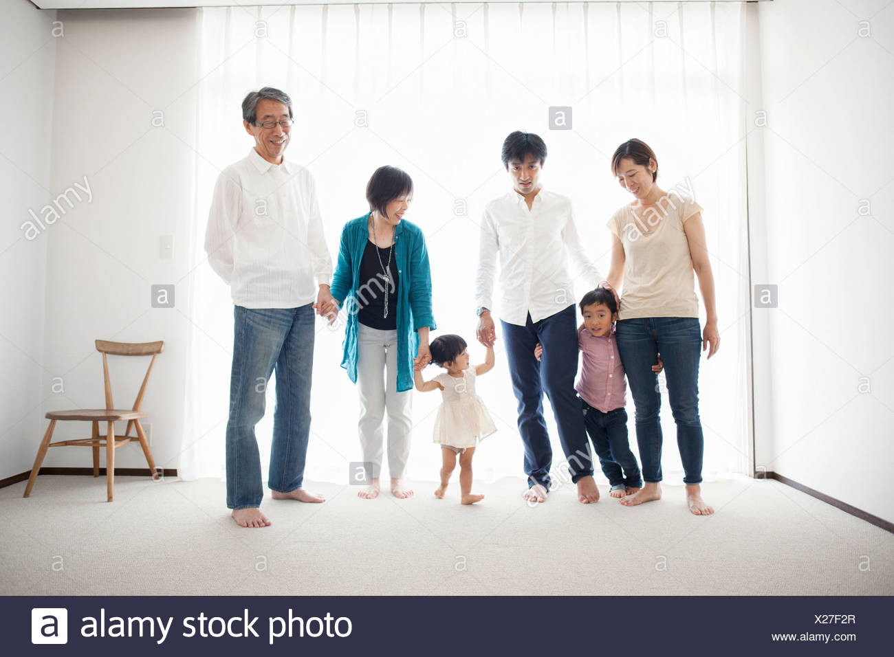 Three Generation Family Holding Hands High Resolution Stock Photography ...
