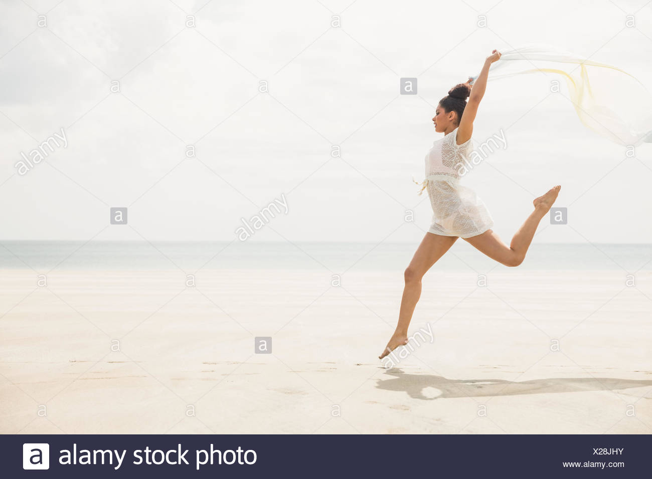 Leaping Woman Dress Stock Photos & Leaping Woman Dress Stock Images - Alamy