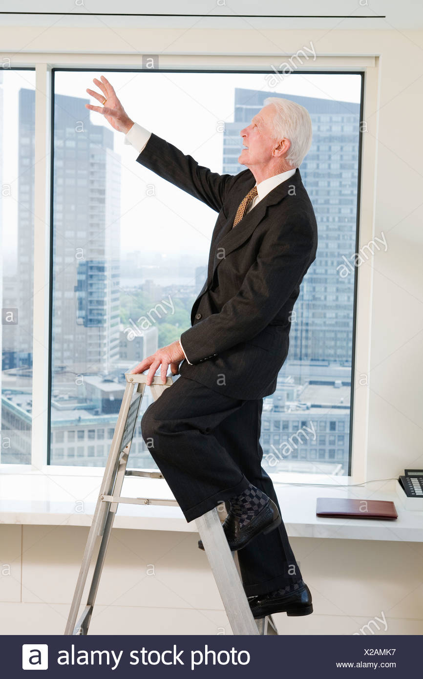 Man Climbing Out Of Window High Resolution Stock Photography and Images ...