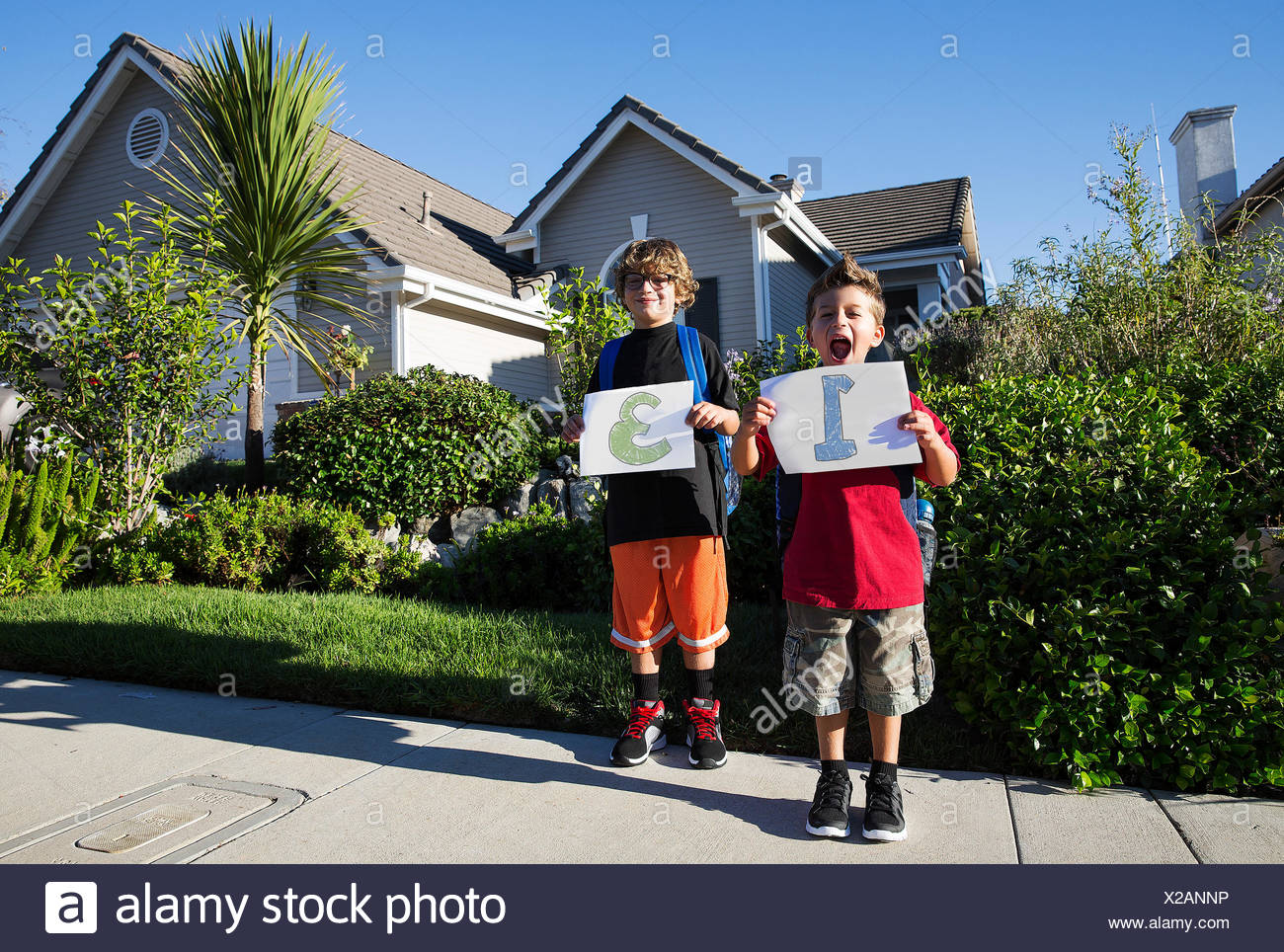 Boy Holding Up Paper High Resolution Stock Photography and Images - Alamy