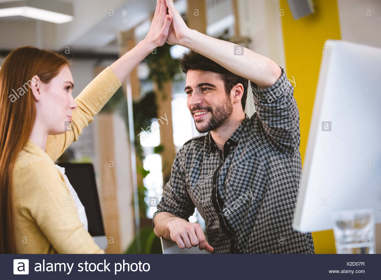 Coworker High Five High Resolution Stock Photography and Images - Alamy