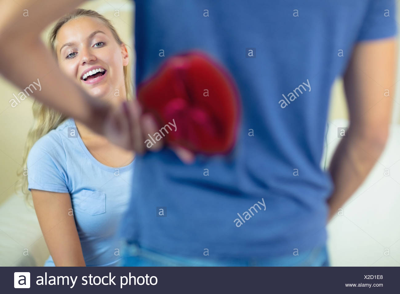 Woman Hiding Present Behind Back High Resolution Stock Photography and ...
