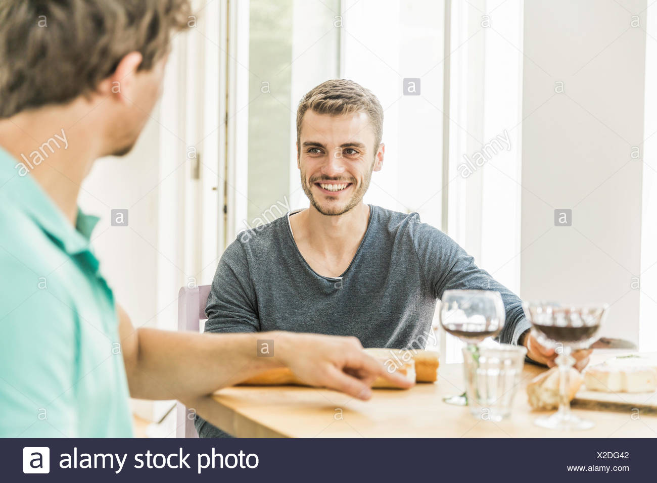 Sitting At Dining Table High Resolution Stock Photography and Images ...