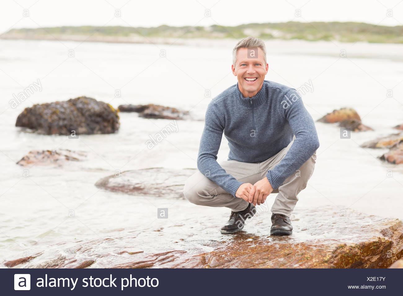 Man Crouched Down High Resolution Stock Photography and Images - Alamy
