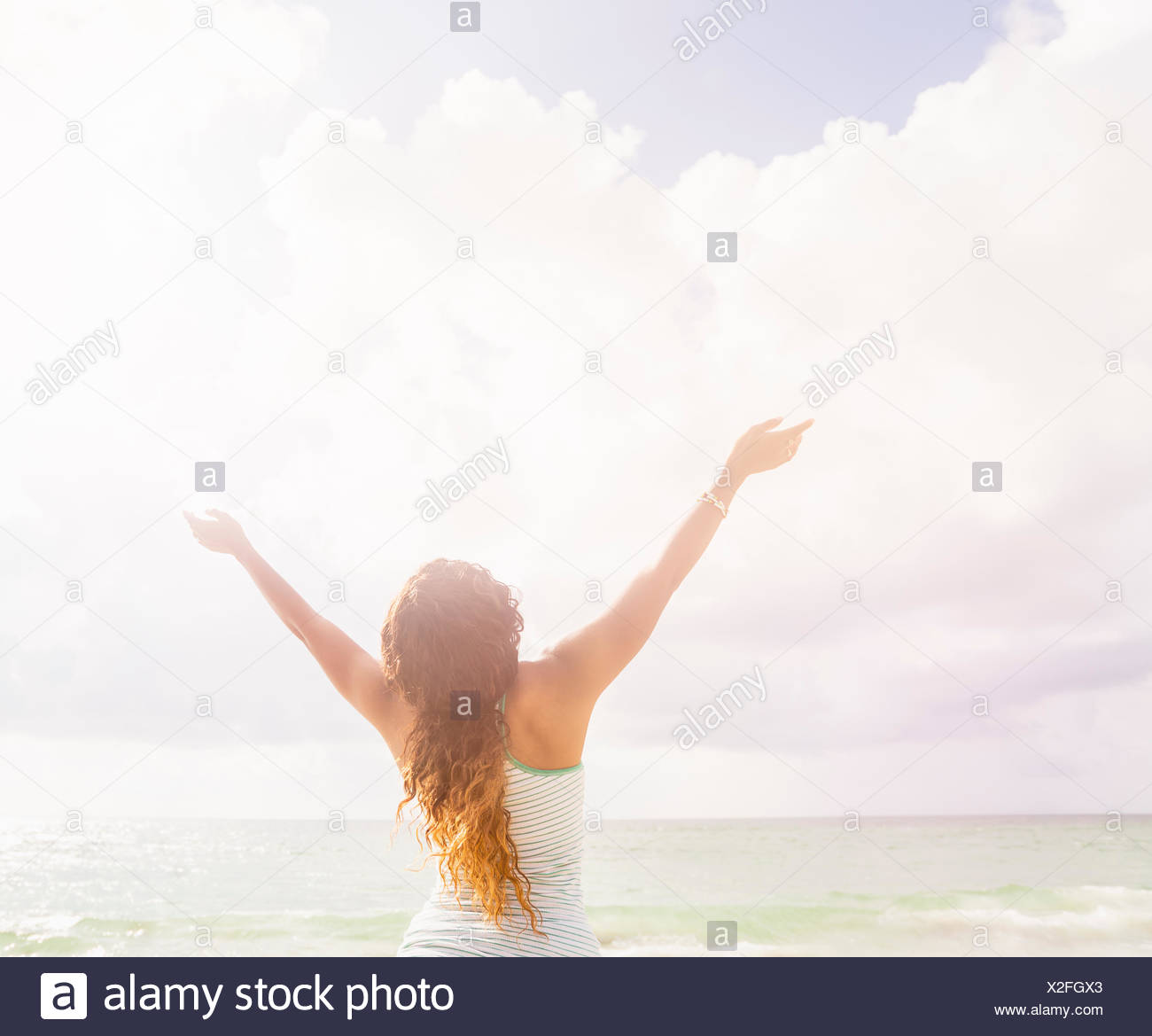 Woman Standing With Open Arms High Resolution Stock Photography and ...