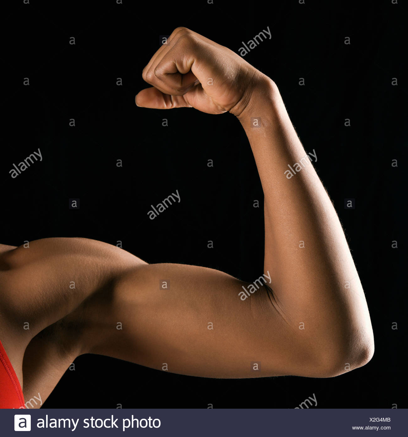 African American Woman Flexing Bicep High Resolution Stock Photography ...