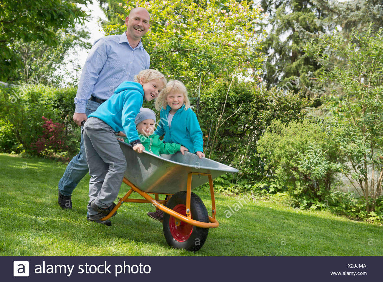 Wheelbarrow Children Wheelbarrow High Resolution Stock Photography and ...