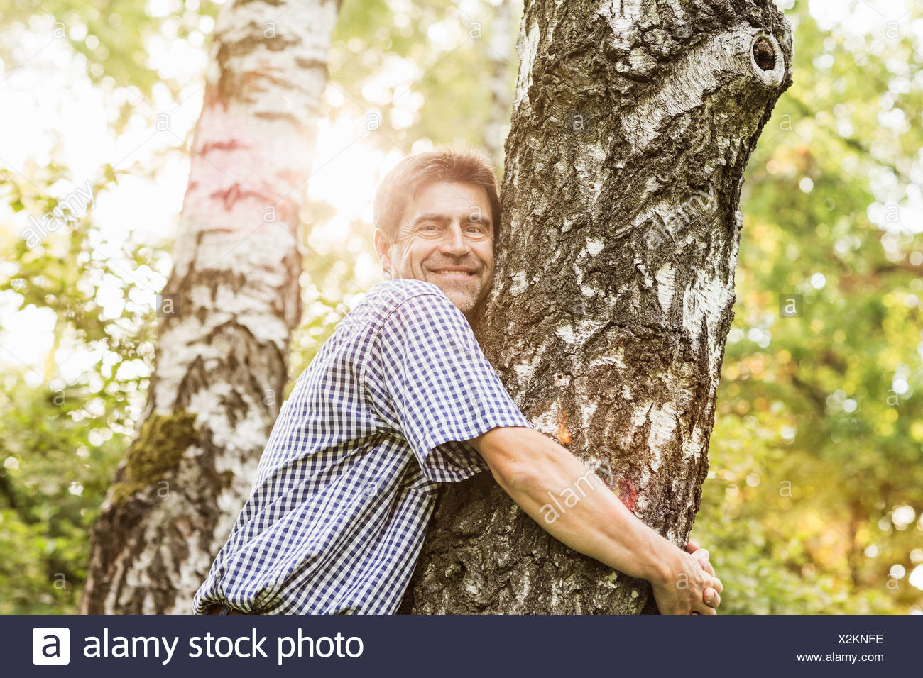 Man Hugging Tree High Resolution Stock Photography and Images - Alamy