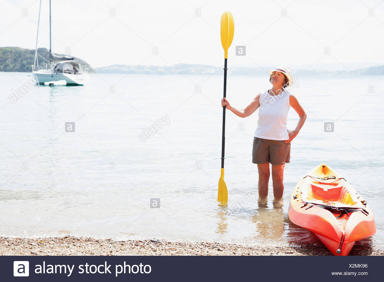Smiling Woman Holding Paddle High Resolution Stock Photography and ...