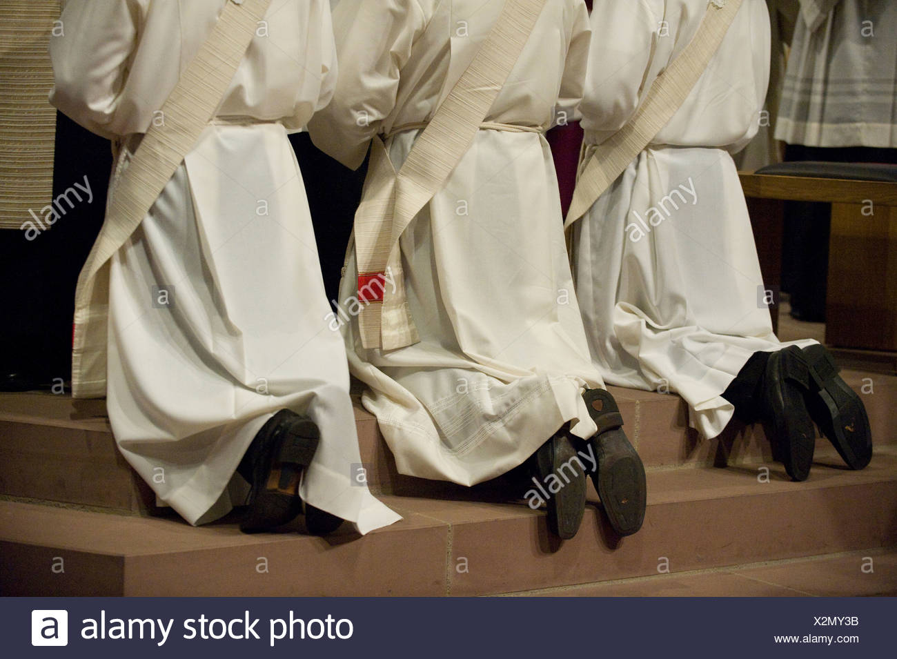 Kneeling Priest High Resolution Stock Photography and Images - Alamy