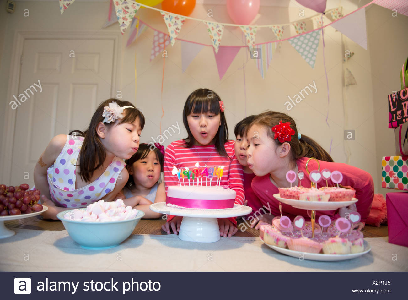 Blowing Out Birthday Cake Stock Photos & Blowing Out Birthday Cake ...