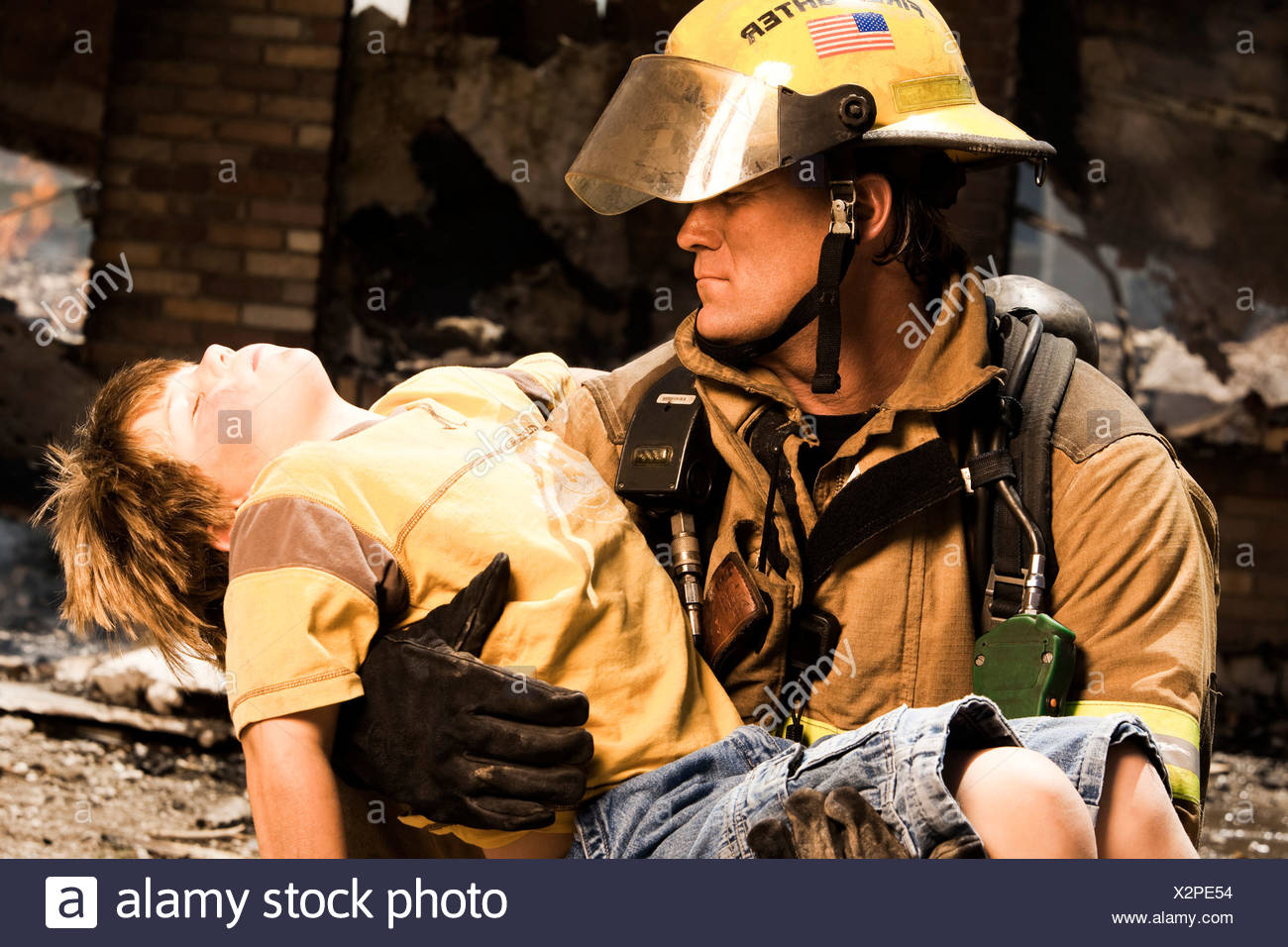 Firefighter Rescuing Child High Resolution Stock Photography and Images ...