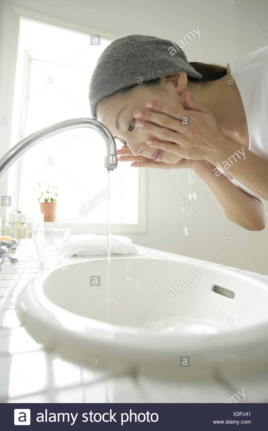 Woman Bending Over Sink Stock Photos & Woman Bending Over Sink Stock ...